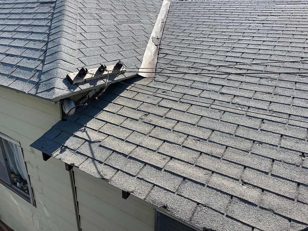 Questionable overhead conductor attachment point and lead service mast ...