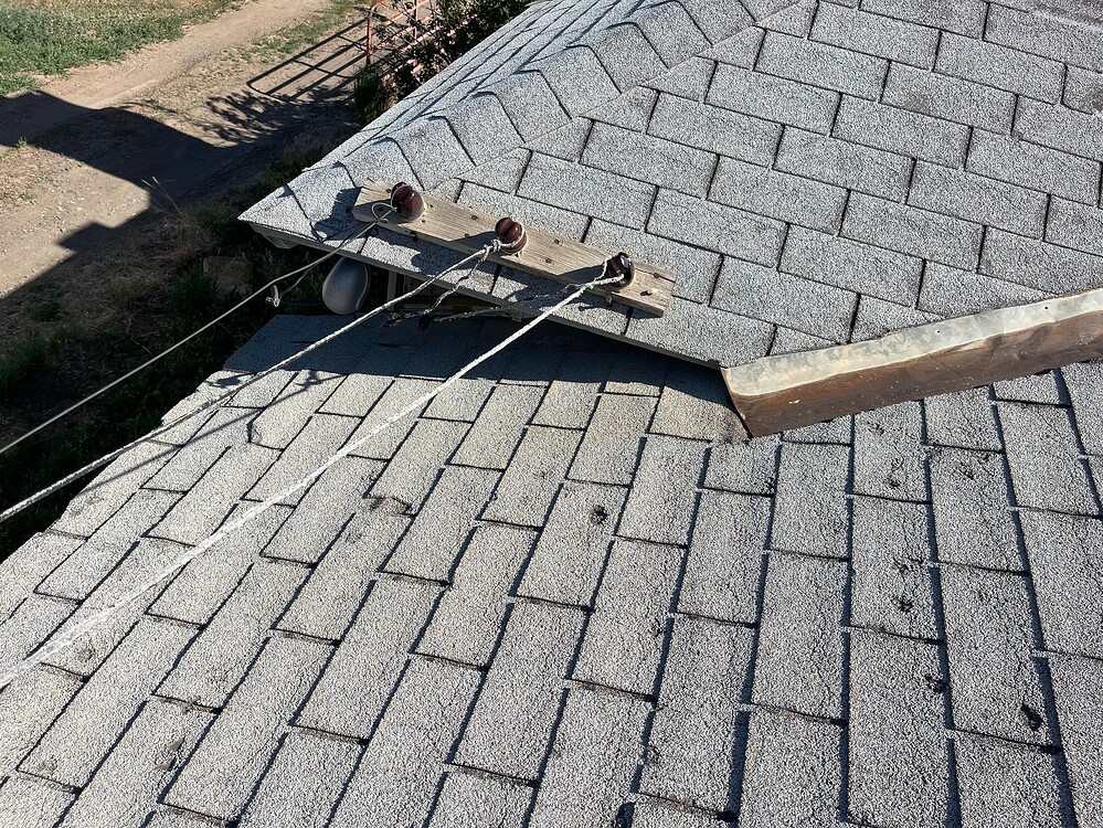 Questionable overhead conductor attachment point and lead service mast ...