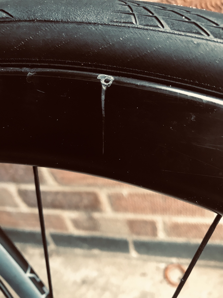 Chipped carbon wheel on trainer - Equipment - TrainerRoad
